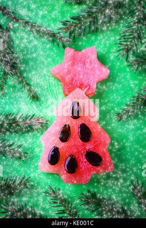 Christmas tree made of watermelon top view. Xmas decor on the table ...