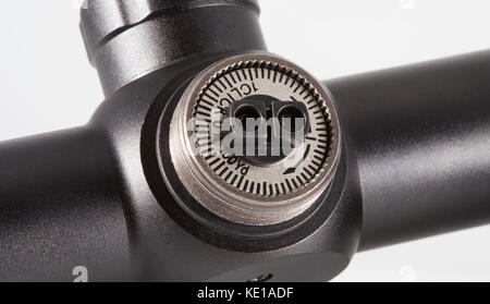 Knob on a rifle scope that is used to adjust elevation isolated on ...