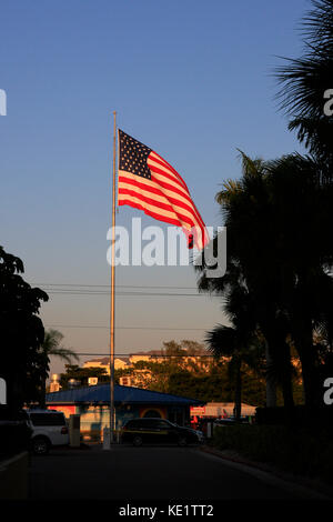 The American flag at sunset at Siesta Key in Sarasota FL Stock Photo ...