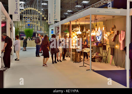 Interior of Birmingham NEC exhibition hall with crowds of people ...