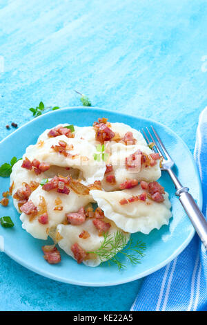 Fried piroggi with bacon and onion Stock Photo - Alamy