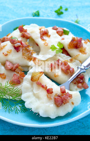 Fried piroggi with bacon and onion Stock Photo - Alamy