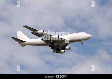 An unmarked, all white, Boeing 747 Jumbo jet approaches landing at LAX ...
