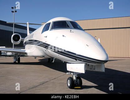 Front view of the luxury private jet on the winter airport apron on the ...
