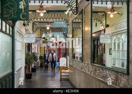 Town centre shopping arcade at St Austell and Holy Trinity Church ...