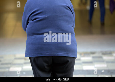 large fat obese person woman with walking stick truncated viewed from ...