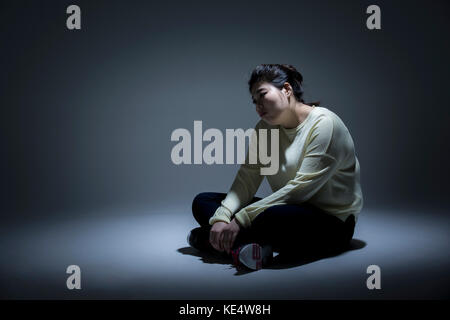 Young fat woman gloomy going on diet Stock Photo - Alamy
