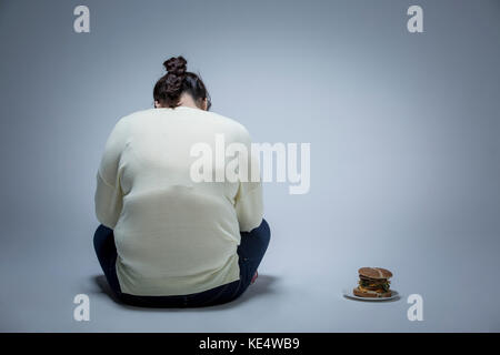 Fat woman gloomy going on diet Stock Photo - Alamy
