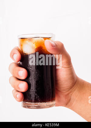 hand holding cola with ice in glass isolated on white background Stock ...