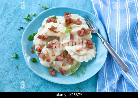 Fried piroggi with bacon and onion Stock Photo - Alamy