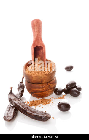 Carob on white background. Organic carob pods with seeds Stock Photo ...