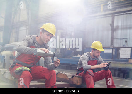 Factory workers taking break Stock Photo - Alamy