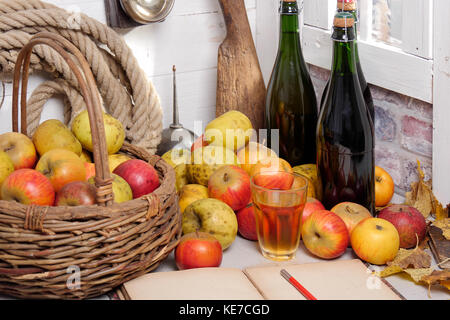 basket of apples, bottles of cider and old notebook Stock Photo - Alamy