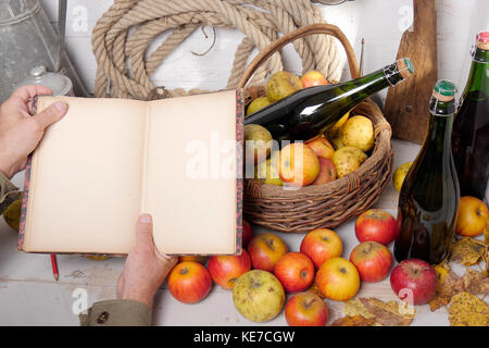 basket of apples, bottles of cider and old notebook Stock Photo - Alamy