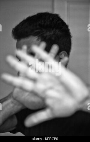 Man Blocking Face with Hands Stock Photo - Alamy
