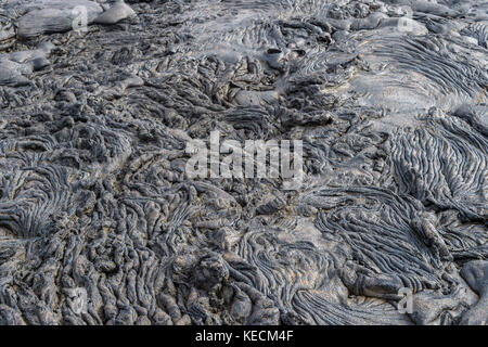 Pahoehoe or rope lava, on Rabida Island, Galapagos. It is formed of ...