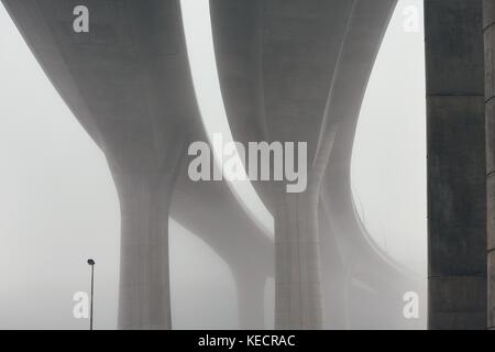 Pillars of the highway bridge in mysterious morning fog. Prague, Czech ...