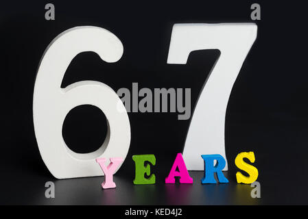 Letters and numbers-sixty-seven on black isolated background Stock ...