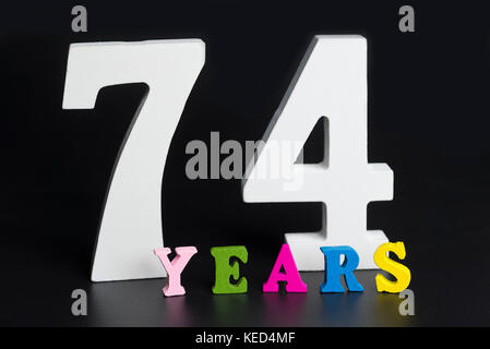 Green Number 74 isolated white background Stock Photo - Alamy