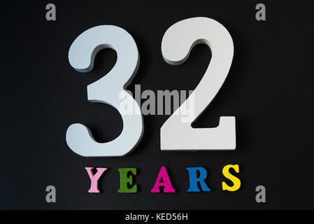 Letters and numbers thirty-two on a black isolated background Stock ...