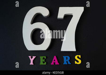 Letters and numbers-sixty-seven on black isolated background Stock ...