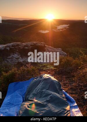 Beautiful awakening in rocks. Sleeping in nature in sleeping bag. View ...