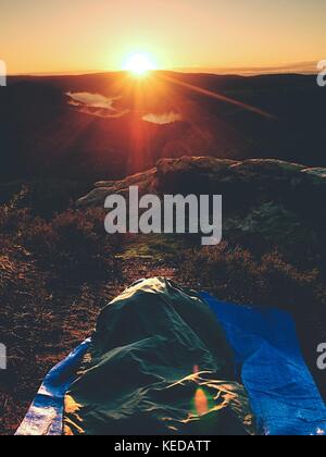 Beautiful awakening in rocks. Sleeping in nature in sleeping bag. View ...