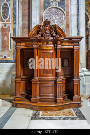 Old wooden confessional box, enclosed booth used for the Sacrament of ...