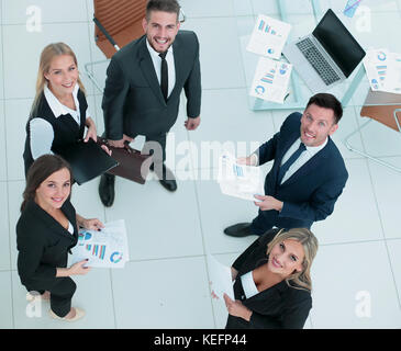 Successful business team discossing documents. High view Stock Photo ...