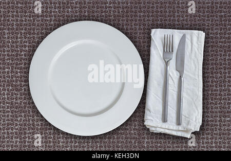Empty plate and cutlery on multiplex plate Stock Photo - Alamy