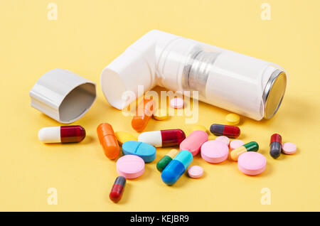 Asthma inhaler and capsule on white background Stock Photo - Alamy