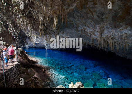 Tourists visiting the Gruta do Lago Azul [grotto of the blue lake] at ...