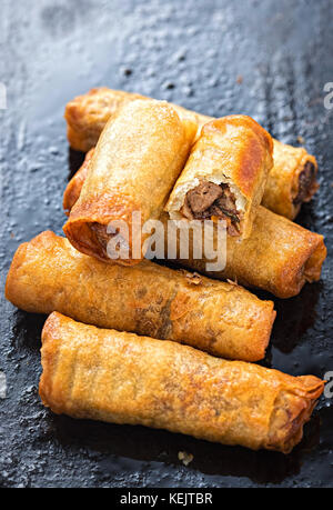 Chinese crispy duck filled spring rolls with soy sauce dip isolated on ...