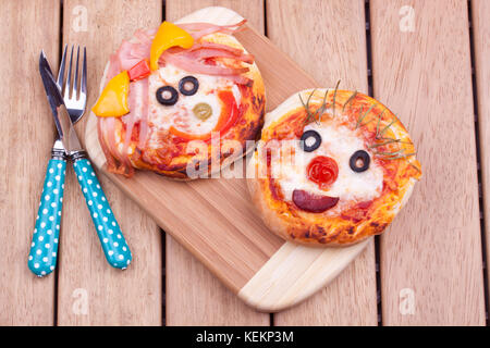 face shape pizza Stock Photo - Alamy