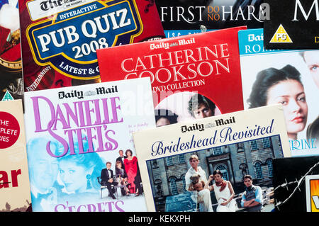 A selection of DVD's given away free with British newspapers Stock ...