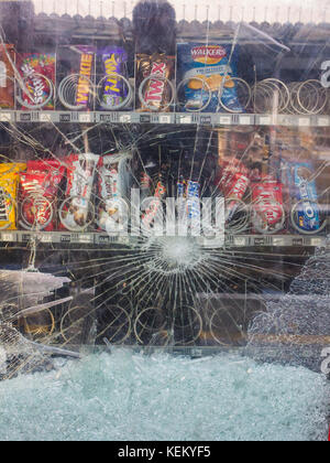 A smashed vending machine on a station platform Stock Photo - Alamy