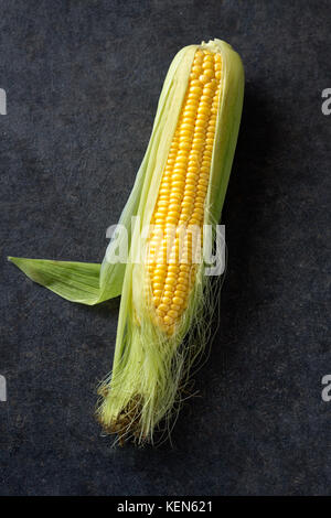 Heap of raw corns seeds, maize or sweetcorn kernels top view on wooden ...