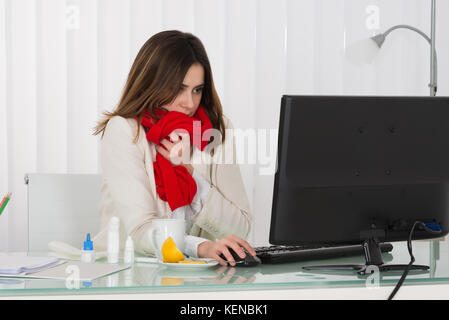Businesswoman employee sick in the office Stock Photo - Alamy
