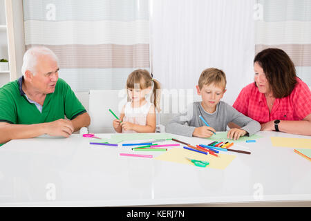 Family of 3 generations drawing Stock Photo - Alamy