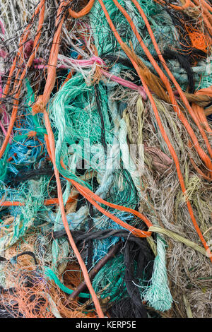 A tangled mess of fishing nets plastic rope and other debris washed up ...