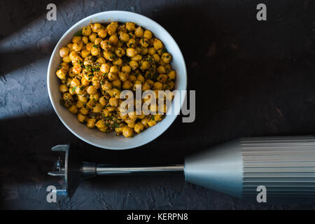 Chickpeas in a ceramic bowl and blender for falafel Stock Photo - Alamy