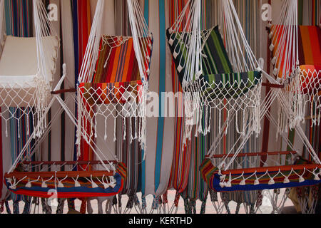 Colorful hammocks for sale at the outdoor craft market in Otavalo ...