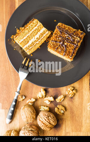 Slice of cake with cream on top Stock Photo - Alamy