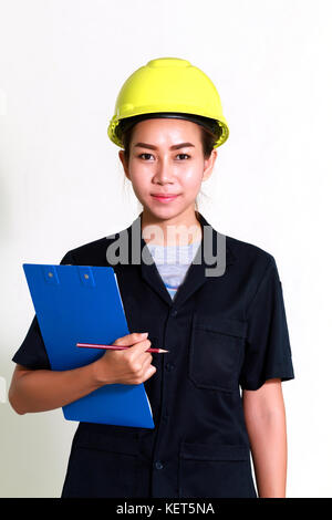 Asian women engineers and technicians are checking the list on the ...