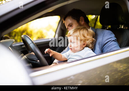 Man driving a small car Stock Photo - Alamy