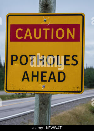 A pot hole warning sign Stock Photo - Alamy