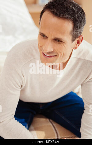 Delighted male person being deep in thoughts Stock Photo - Alamy
