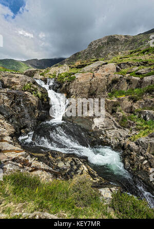 Stream and mountains on the Watkin Path to Snowdon, the highest ...