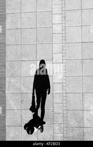 Shadow of a woman walking from above Stock Photo - Alamy