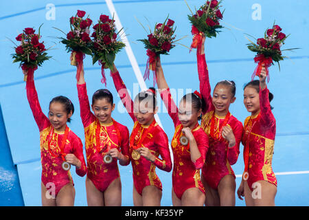 Chinese Olympic gymnastics gold medal winners Liu Xuan, right, Li Ning ...